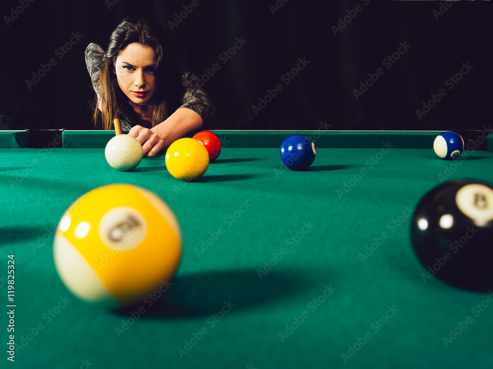 Beautiful woman playing pool Stock Photo | Adobe Stock