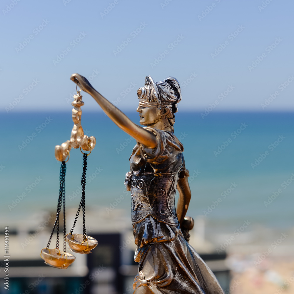 Poster Back side view of Themis - Lady of Justice on blue sky ...