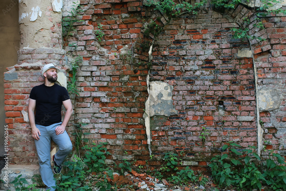 old brick wall man stand Stock Photo | Adobe Stock