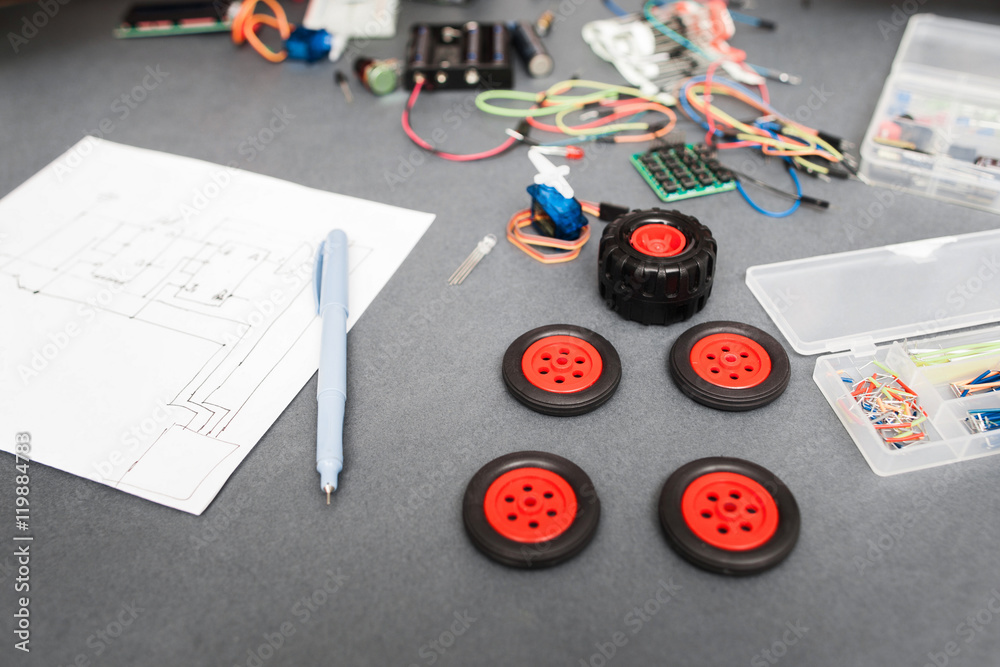 Components and scheme of constructing car at home. Engineer workplace ...