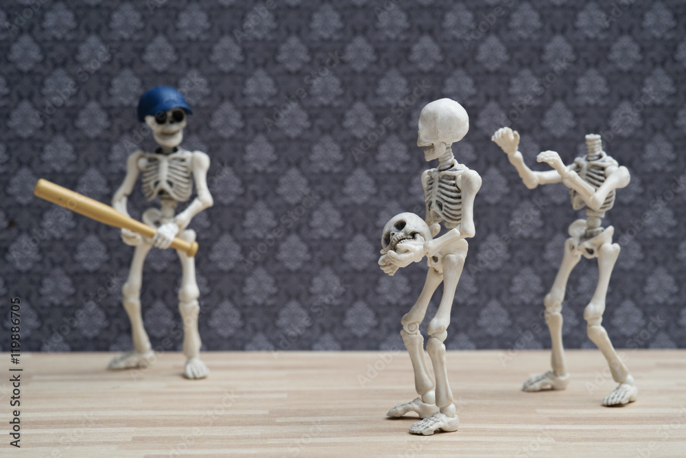 Two skeletons use their friend's head playing baseball Stock Photo ...
