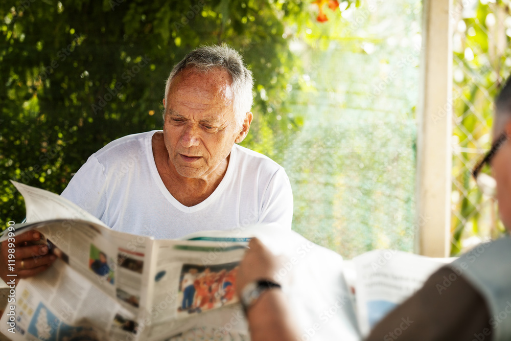 Reading newspapers Stock Photo | Adobe Stock
