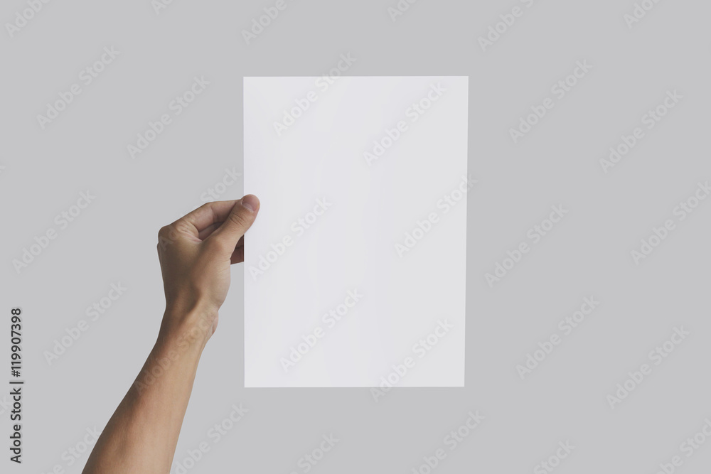 Left hand holding A4 paper in the left hand. Leaflet presentatio Stock ...