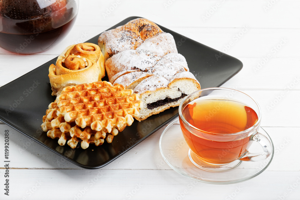 Tea and pastry on white wooden table Stock Photo | Adobe Stock
