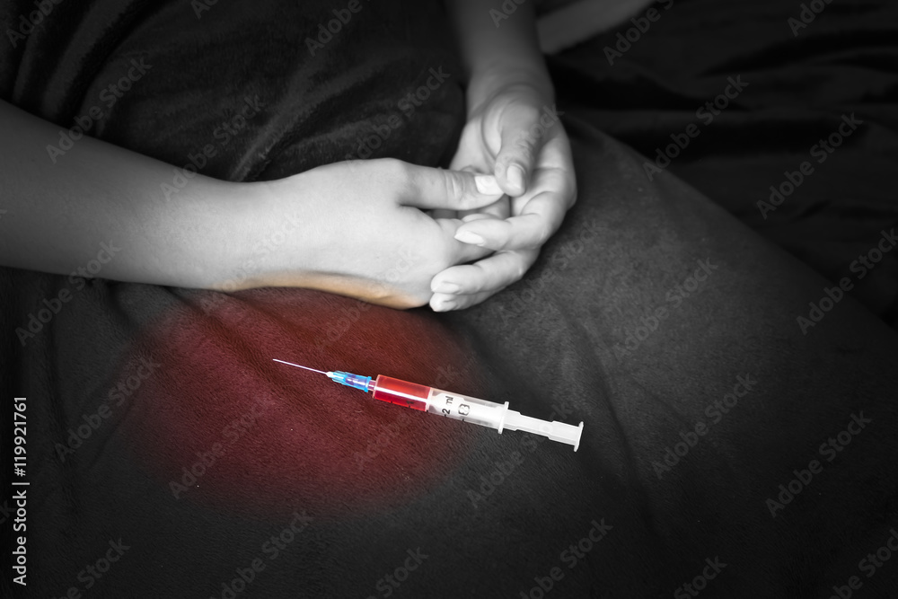 Stabbing drugs. the syringe and the hand enters injections, drugs ...