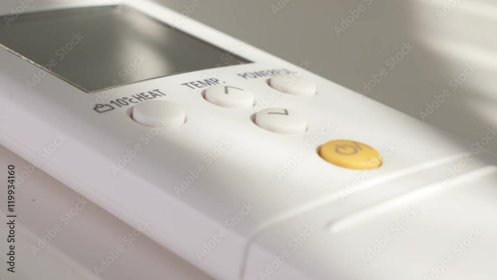 Lowering room temperature on air conditioner remote buttons 4K ...