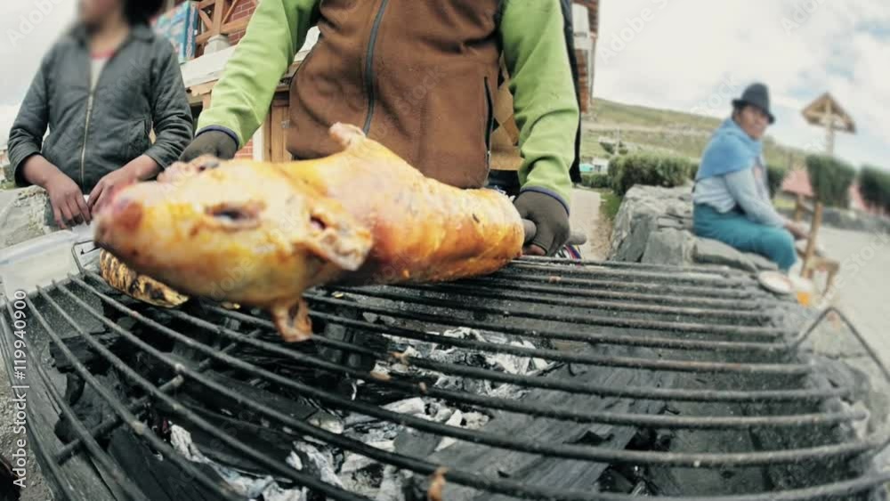 Cooking on the grill the traditional plate of the Andes the guinea pig ...