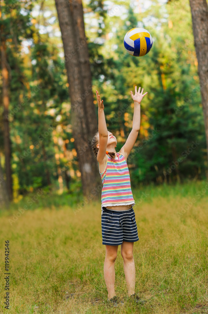 girl throwing a ball Stock Photo | Adobe Stock