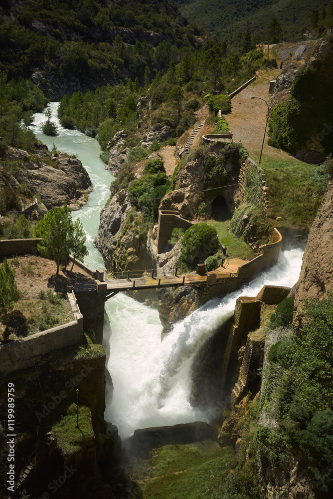 River, waterfall, pedestrian bridge, lookouts and stairs among wooded ...