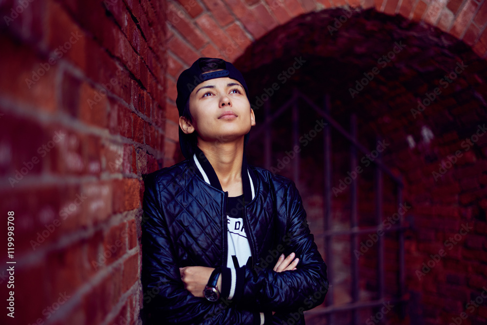Dreaming asian woman near brick wall. Thinking emotion. Close up ...