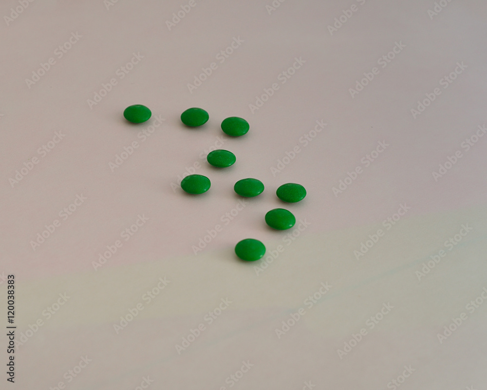 Small green pills Stock Photo | Adobe Stock