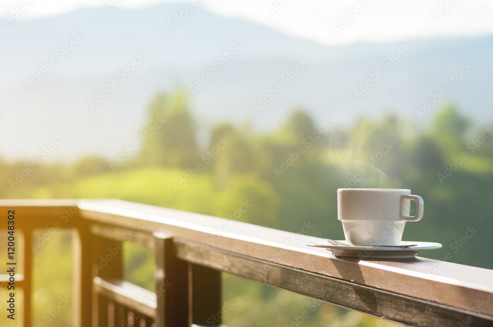 White cup of hot coffee on balcony with natural and mountains. Stock ...