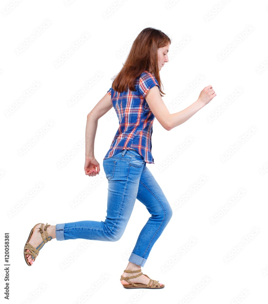 side view of running woman. beautiful girl in motion. Girl in plaid ...