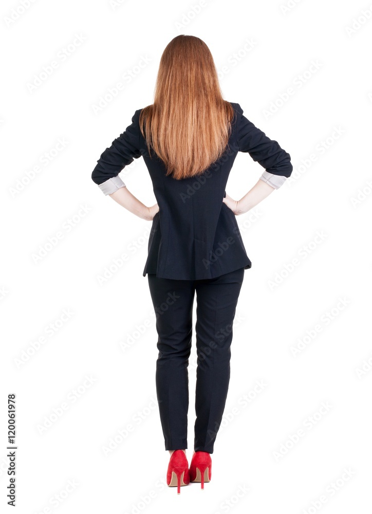 back view of redhead business woman contemplating. Young girl in suit ...