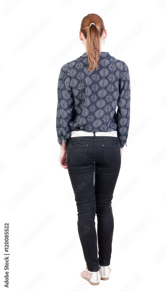 back view of standing young beautiful brunette woman. girl watching ...