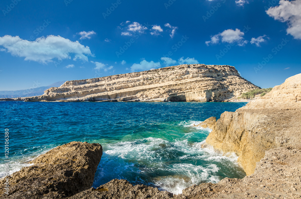 Matala beach on Crete island, Greece. Tourists relax and bath in ...