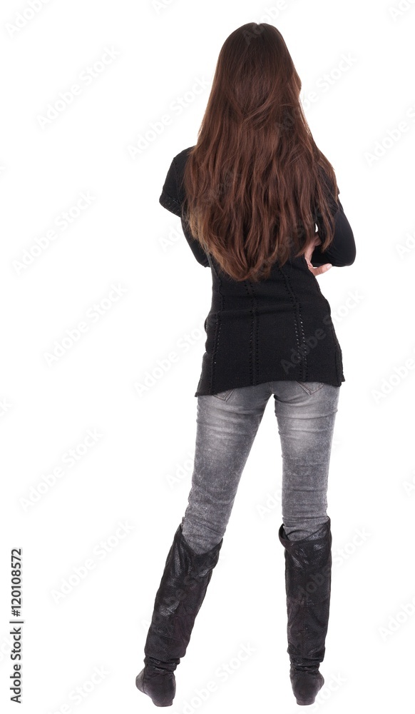 back view of standing young beautiful woman. brunette girl in red ...