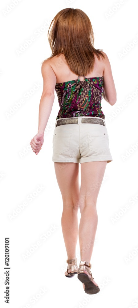 back view of running woman white shorts. beautiful blonde girl in ...