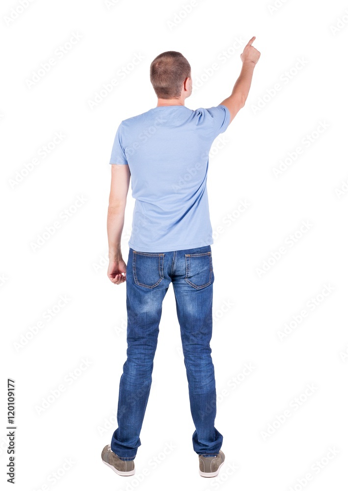 Back view of pointing young men in shirt and jeans. Young guy gesture ...