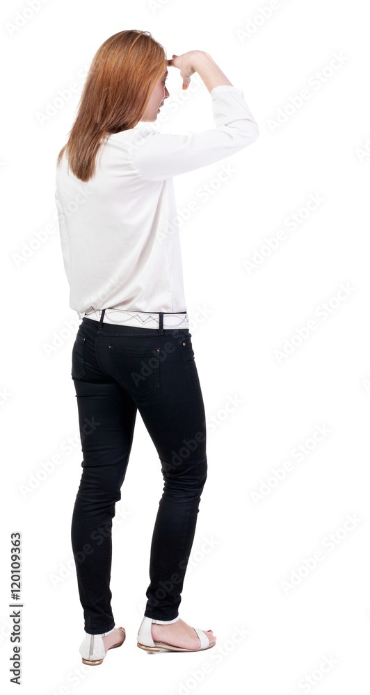 back view of standing young beautiful blonde woman in jeans. girl ...