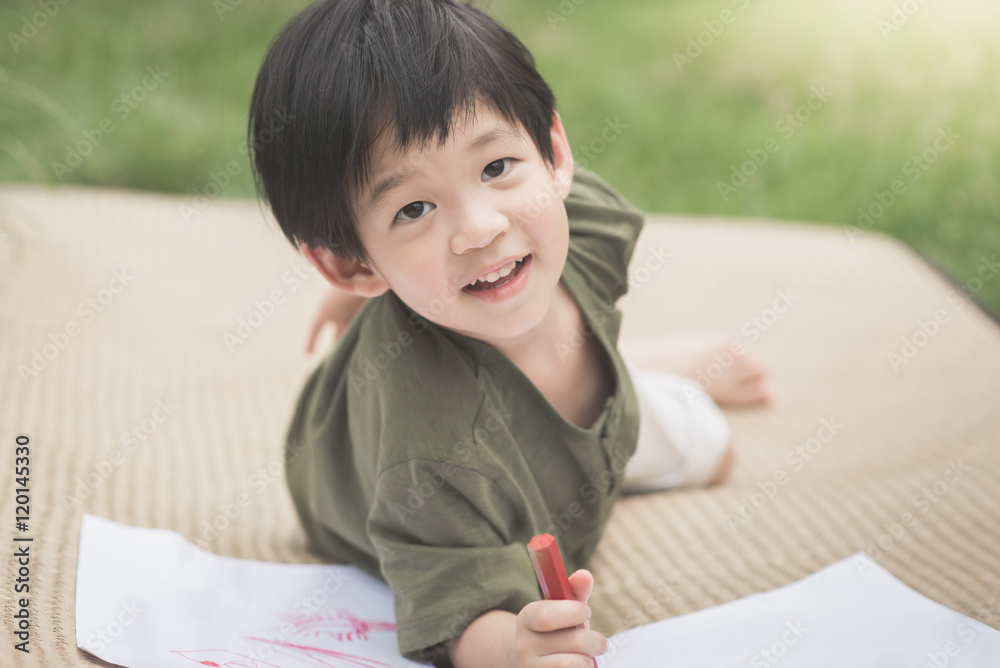child drawing picture with crayon Stock Photo | Adobe Stock