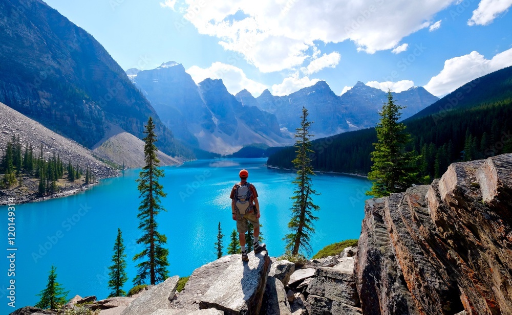 Man hiker on cliff above Moraine Lake. Banff National Park. Alberta ...