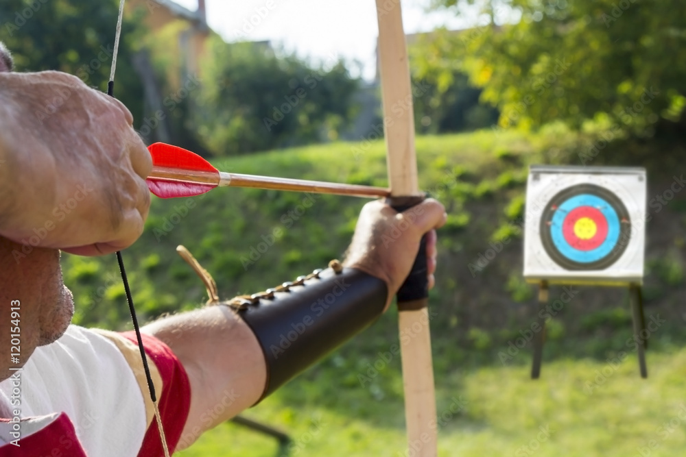 Medieval archer shoot at a target Stock Photo | Adobe Stock