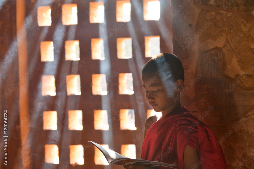 Monk reading in ancient temple,lowlight and sunlight effects,Bagan ...