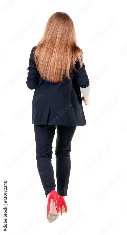 running business woman. back view. going young girl in suit. Rear view ...
