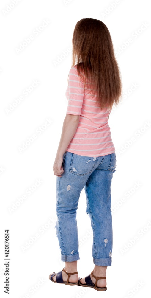 back view of walking woman . beautiful redhead girl in motion. backside ...