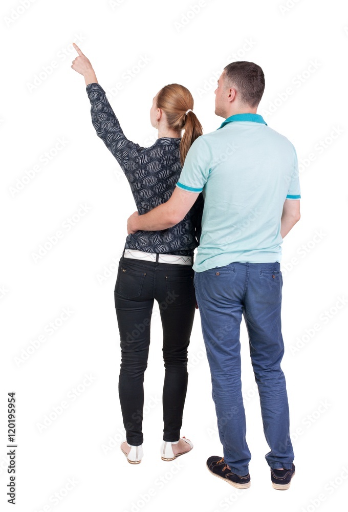 young couple pointing. Back view. Rear view people collection. backside ...