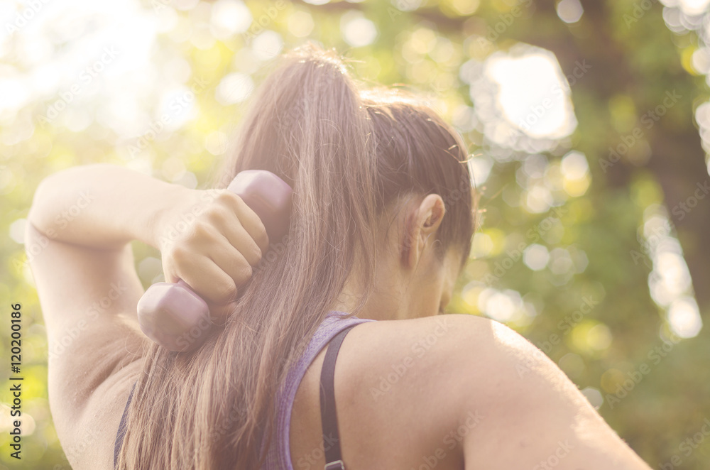 Beautiful young fit woman in sportswear doing exercises Stock Photo ...