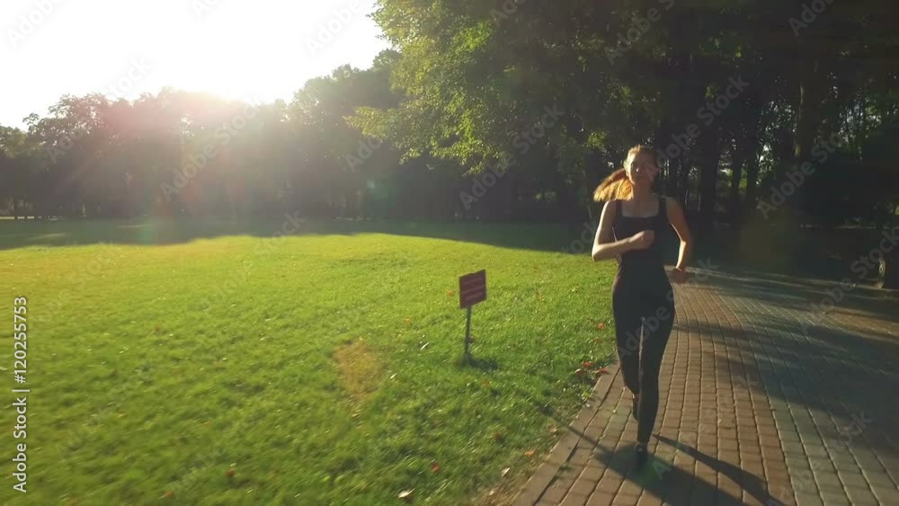 Runner woman running in park exercising outdoors Stock Video | Adobe Stock