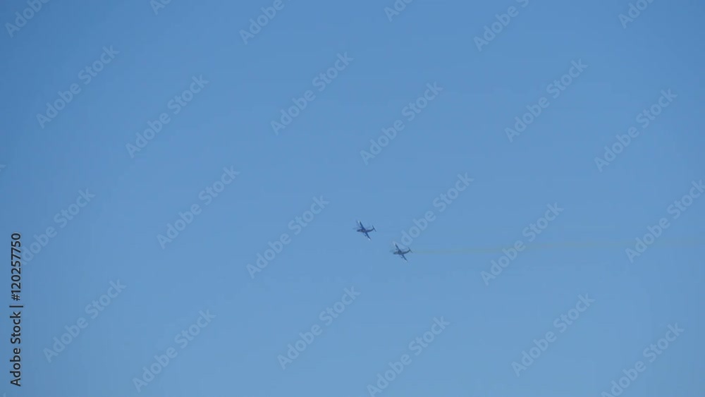 Two planes fly side by side and crossing close together during an ...