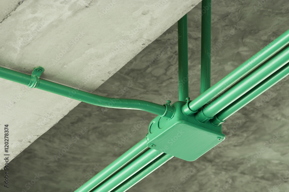 Installed Conduit painted with green color Stock Photo | Adobe Stock
