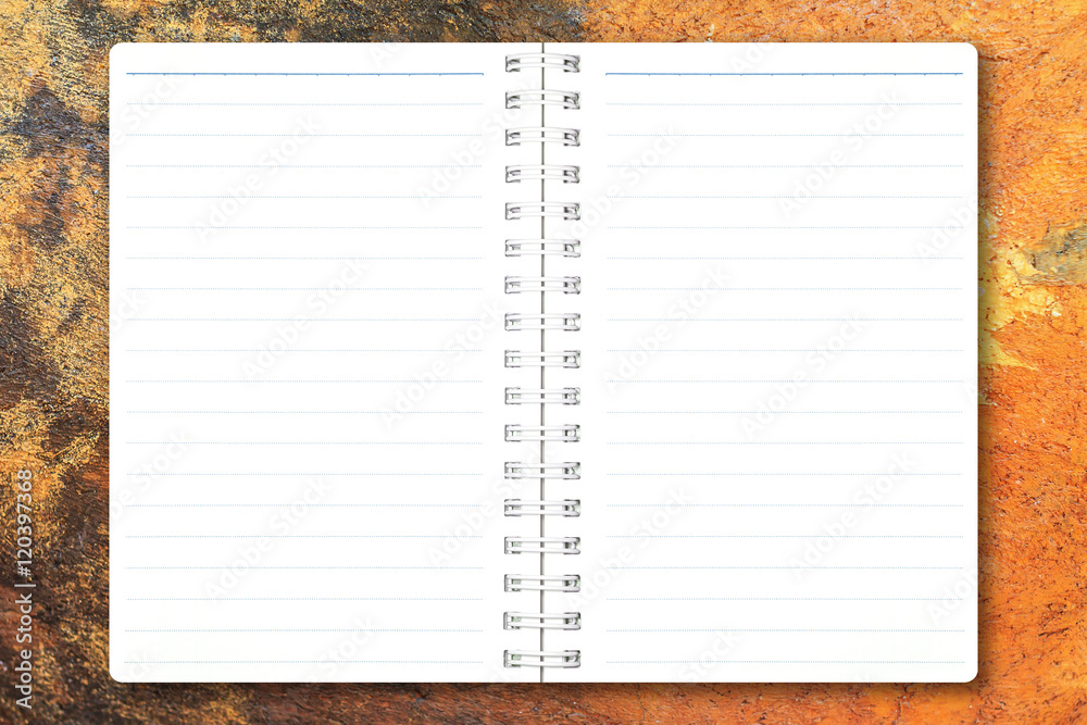 Open notebook paper page with blue line on cement wall background for ...