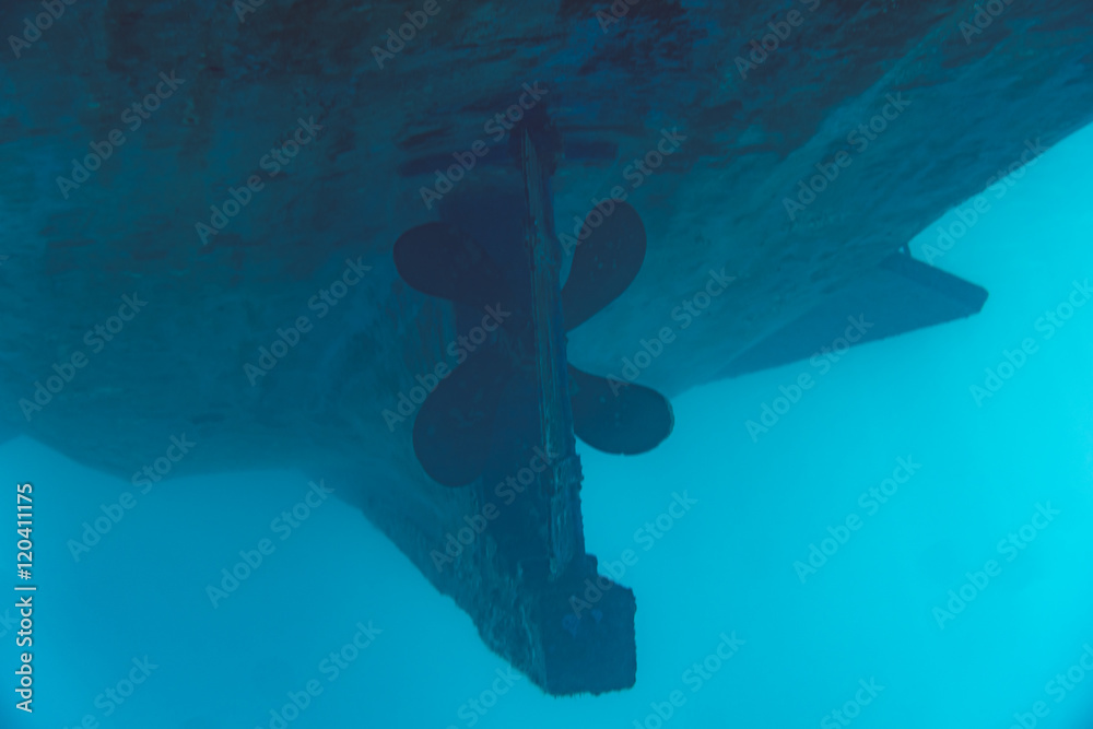 Boat propeller and rudder on a large vessel in blue water Stock Photo ...