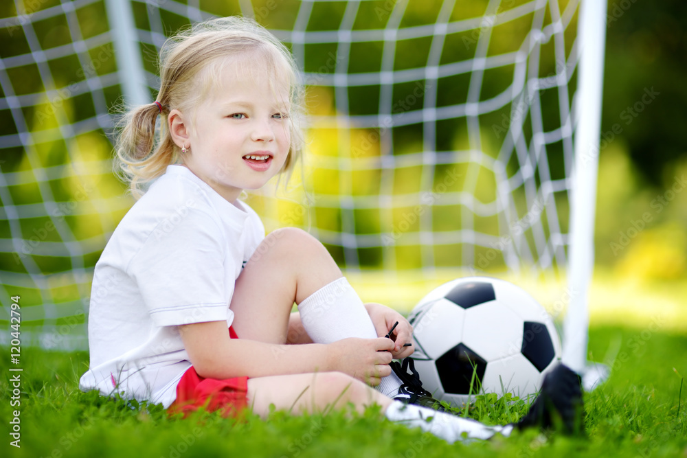 Cute little soccer player having fun playing a soccer game Stock Photo ...