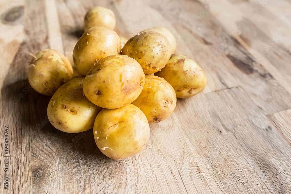 beautiful pile of small rounded whole organic potatoes with the peel ...