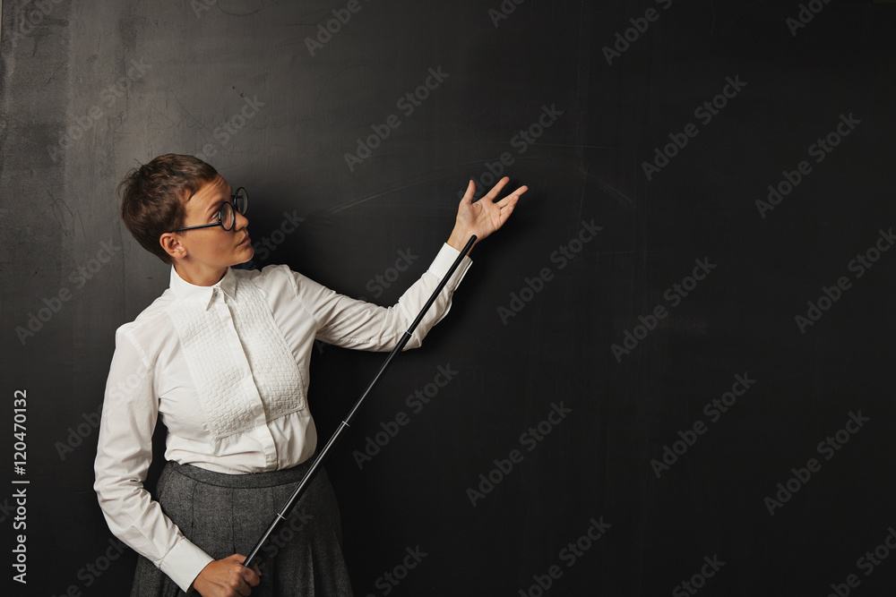 Female teacher with pointer at blackboard Stock Photo | Adobe Stock Female teacher with pointer at blackboard Stock Photo | Adobe Stock