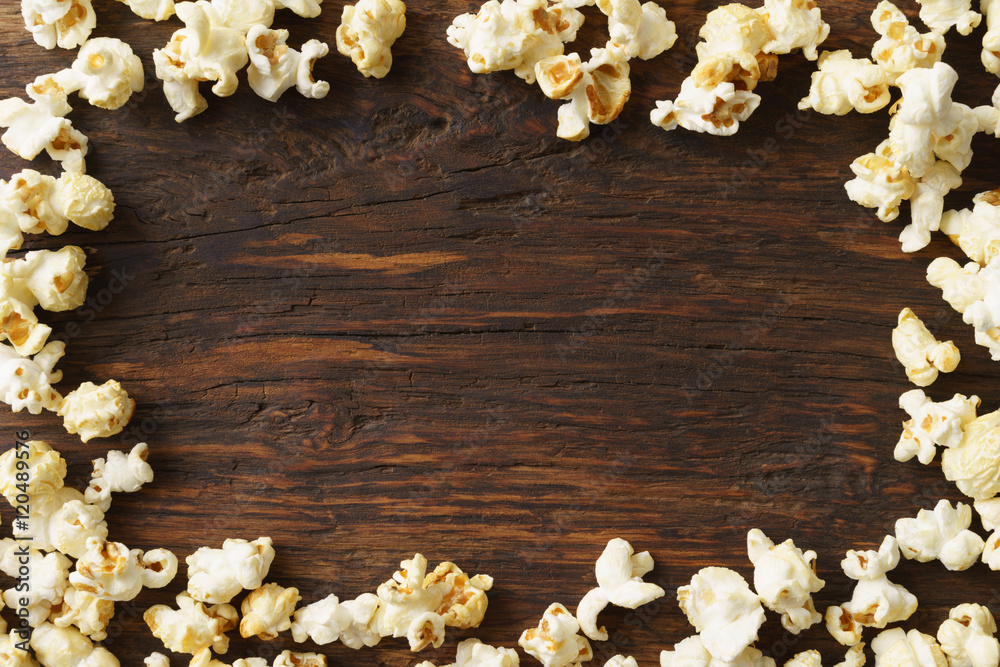 Frame of popcorn on wood background with copyspace Stock Photo | Adobe ...