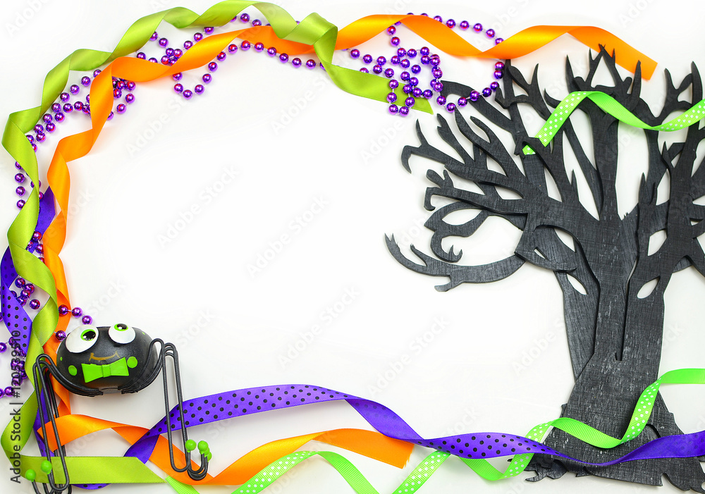 Halloween border of a rough textured wooden cutout of bare tree shape ...
