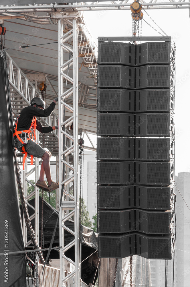 Fotka „Man working on sound and installation stage in a musical event ...