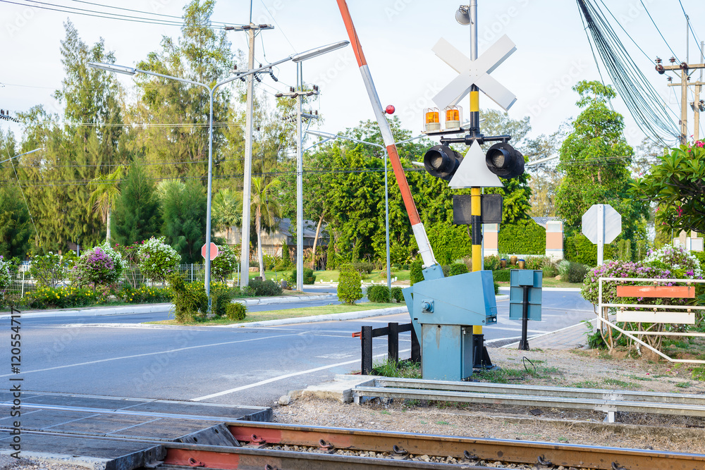 Railroad crossing with barriers Stock Photo | Adobe Stock