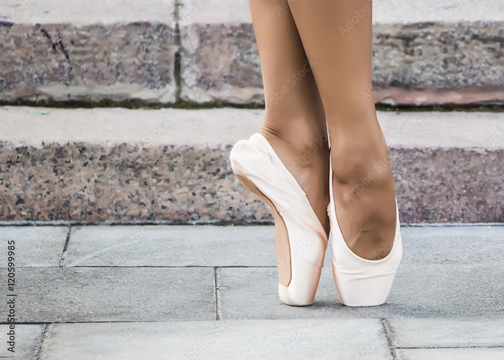 Feet Dressed In Dance Pointe Shoes Sports Shoes On The Background Of Stone Steps Sexy Female