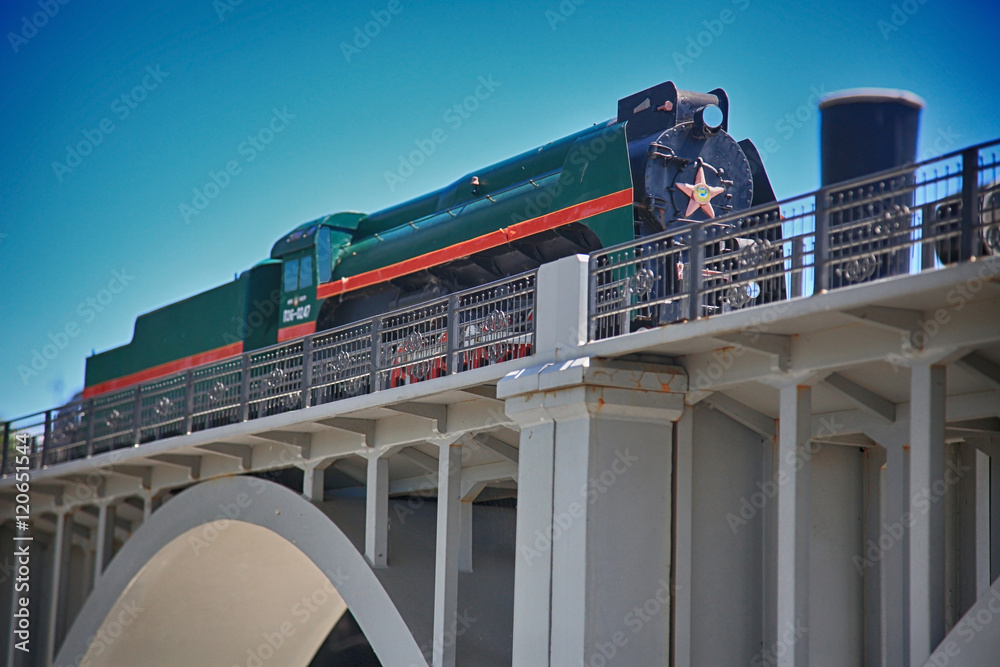 Old steam train at the bridge. Train of times of the Soviet Union of ...