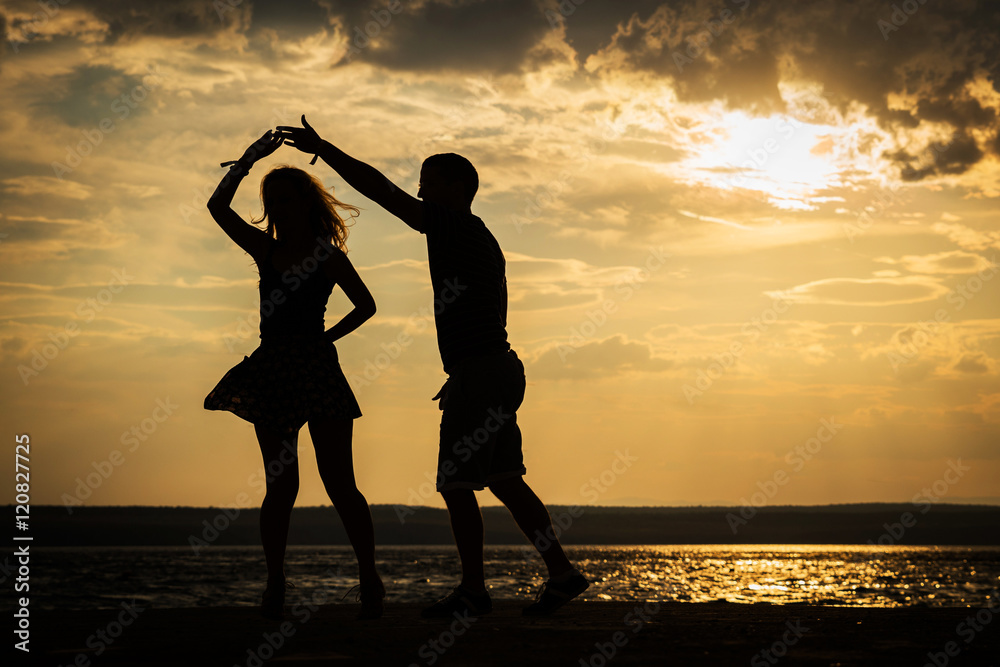 Foto de Couple dancing at sunset salsa / brazilian zouk. Lovers, dance ...