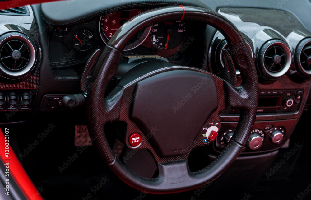 Dashboard and instrument panel, steering wheel in the sport racing car ...