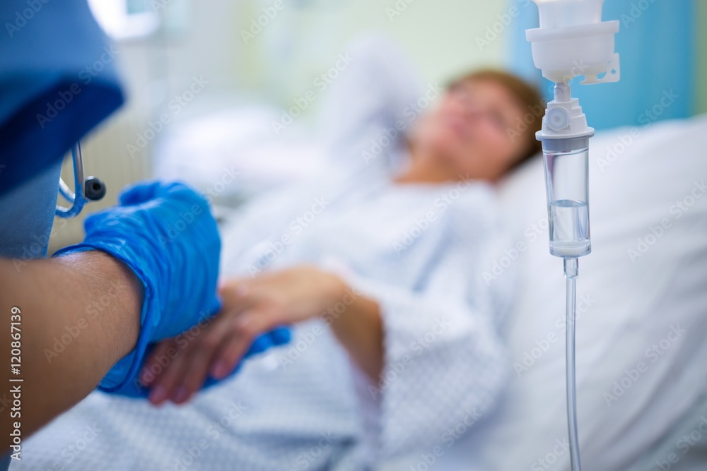 Nurse giving an injection to a patient Stock Photo | Adobe Stock