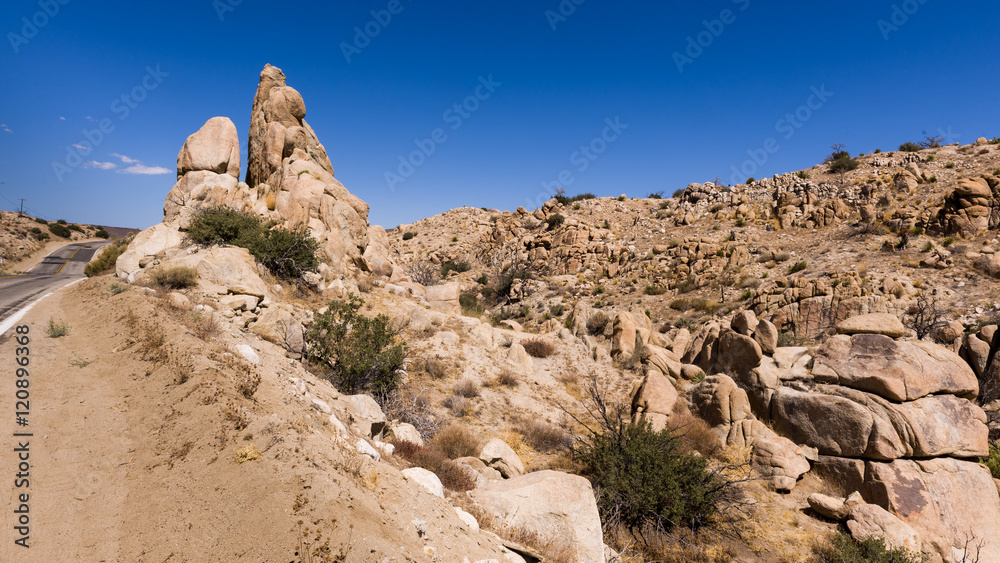 Rocks and boulder formations along the road in Yucca Valley, California ...